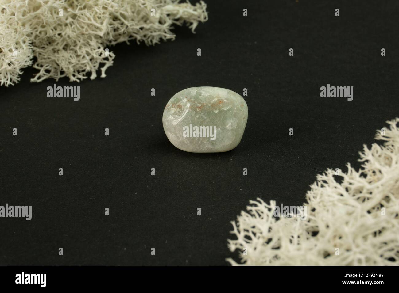 Jadeite from India. Natural mineral stone on black background ...