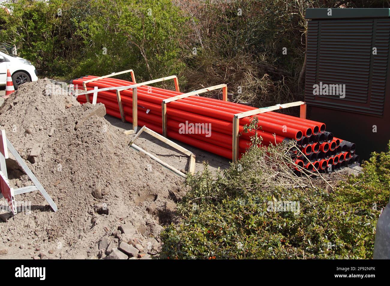 Flexible Cable protection tubes with a red ribbed outside to protect ...