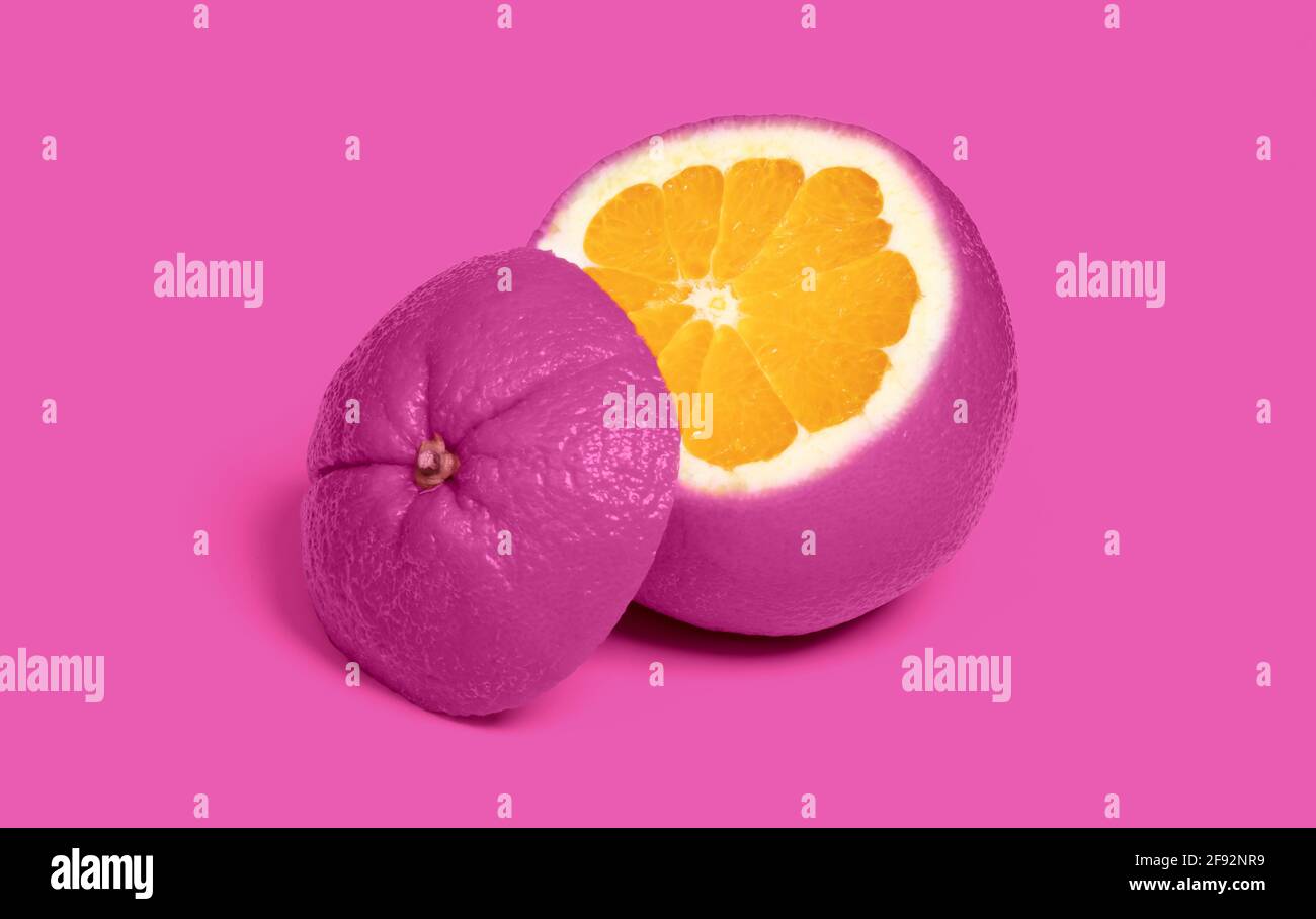 Weird pink sliced orange isolated on a pink background Stock Photo - Alamy
