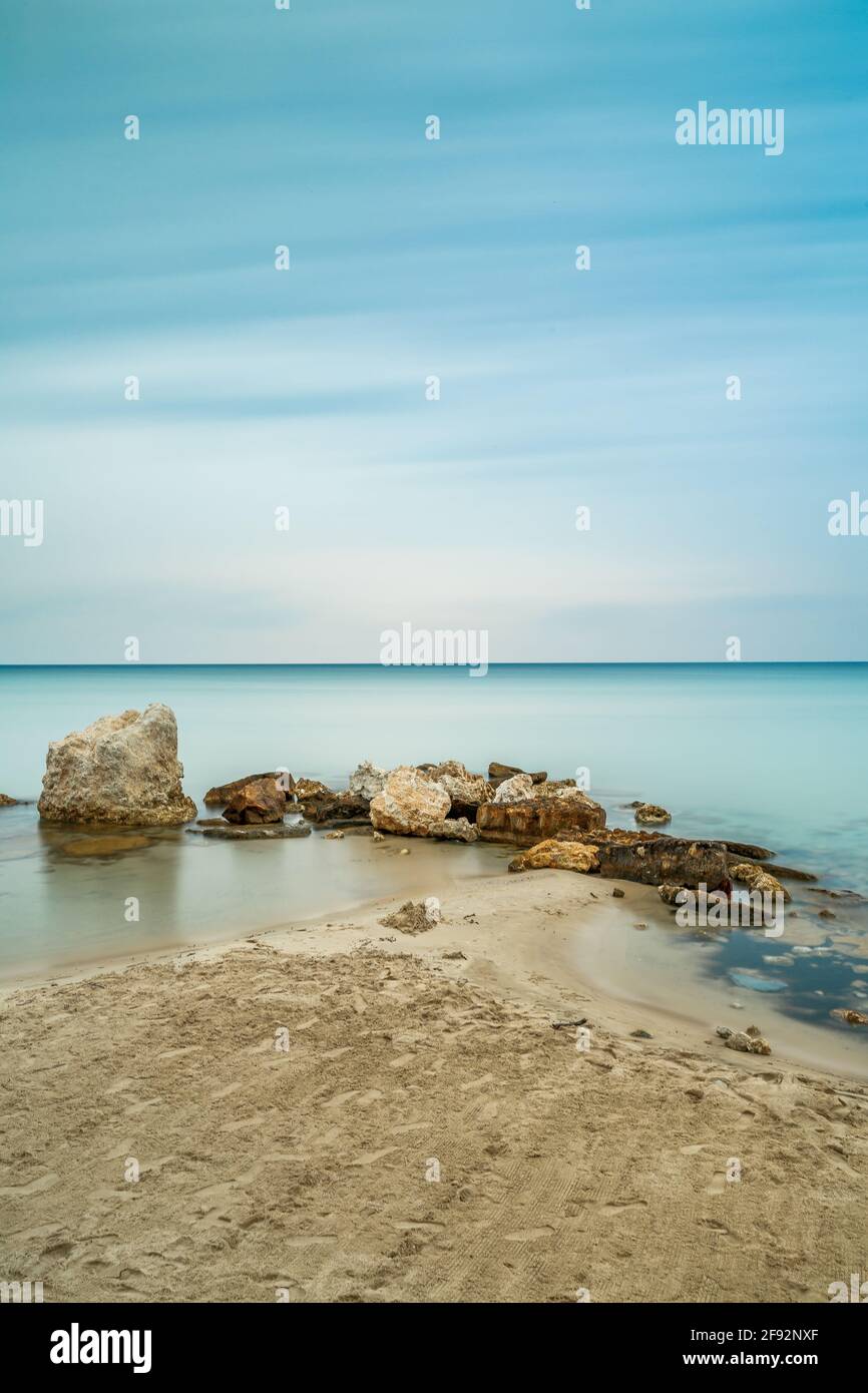 Sand Rocks and Sea Stock Photo - Alamy