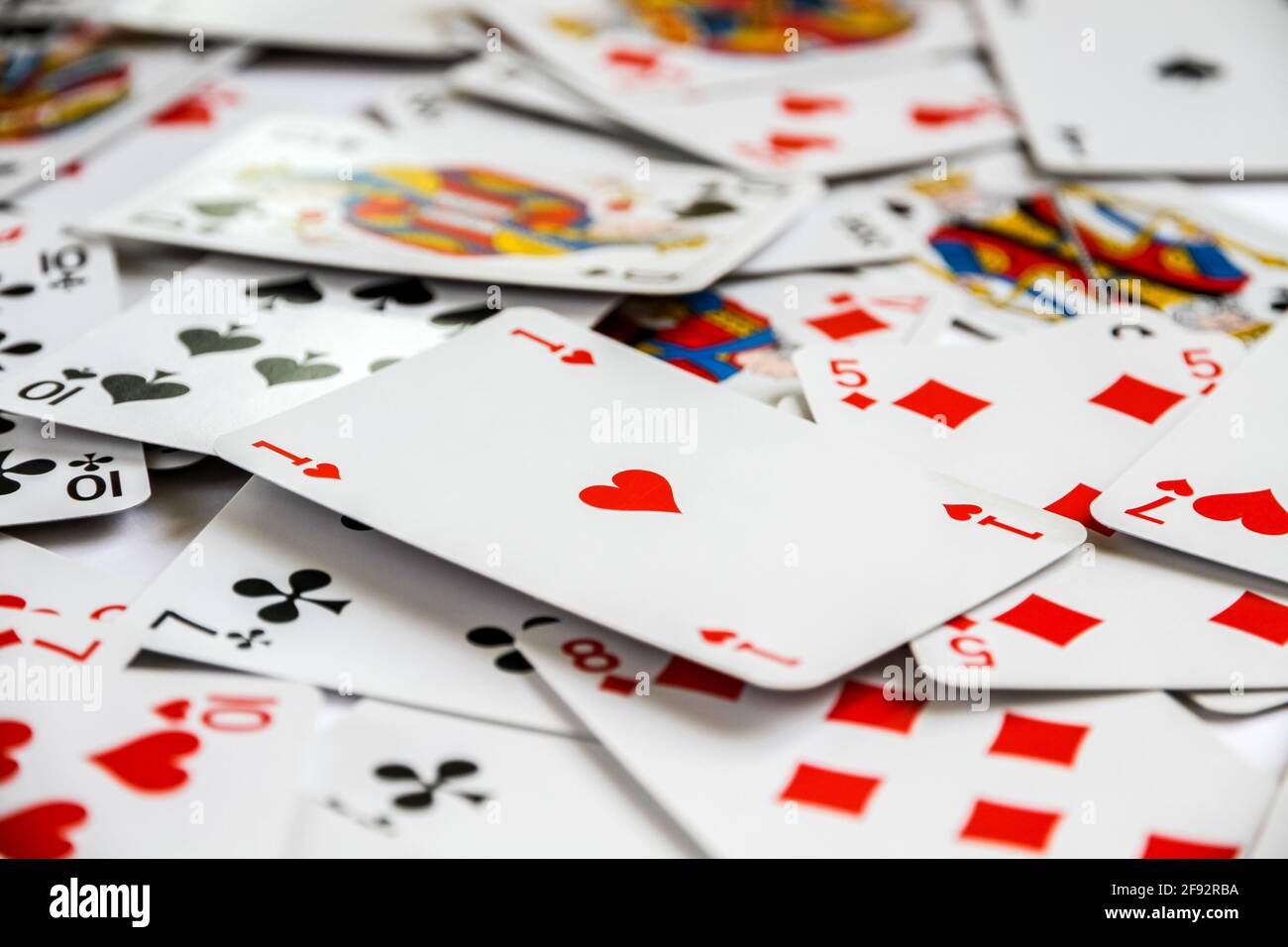 Classic playing card game laid out on a table. White background Stock ...