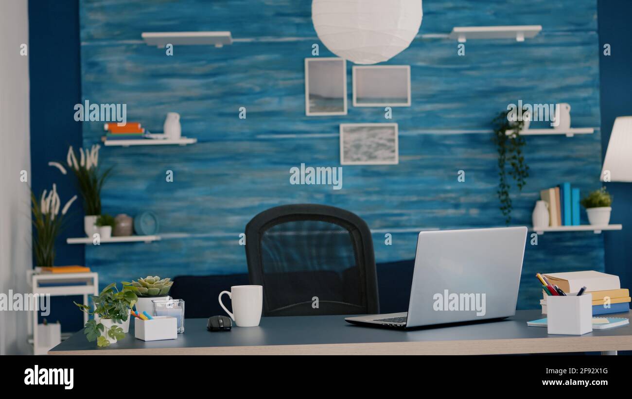 Empty home office with computer in a beautiful, spacious living room ...