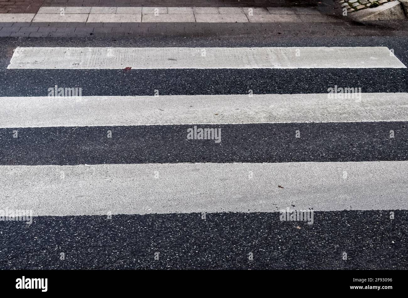White painted pedestrian zebra crossing on a road in Europe Stock Photo ...