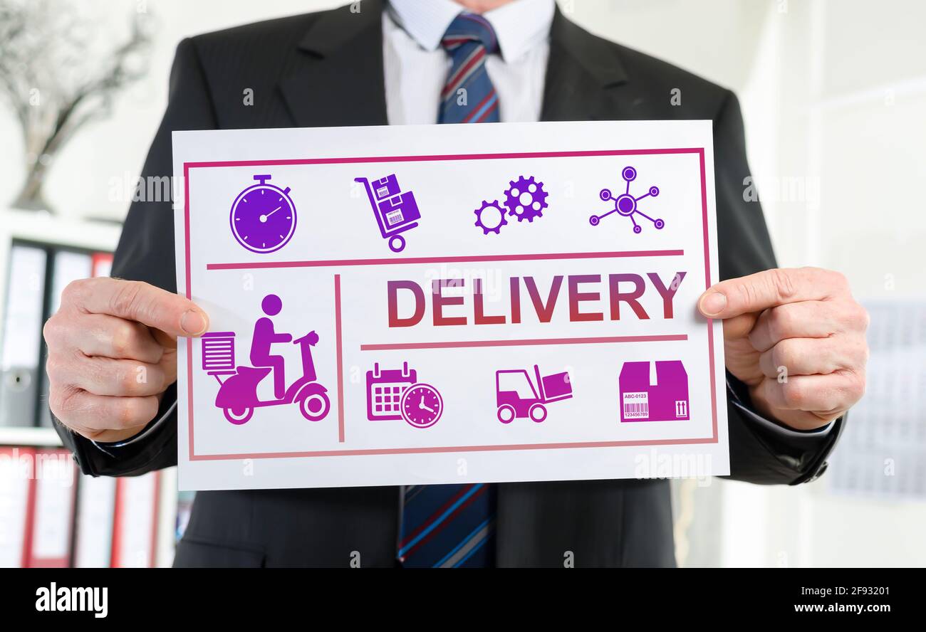 Paper showing delivery concept held by a businessman Stock Photo - Alamy