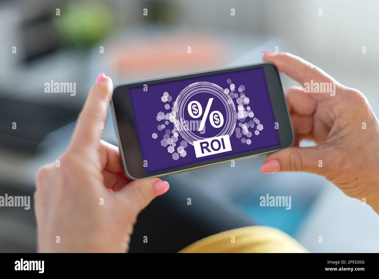 Smartphone screen displaying a roi concept Stock Photo - Alamy