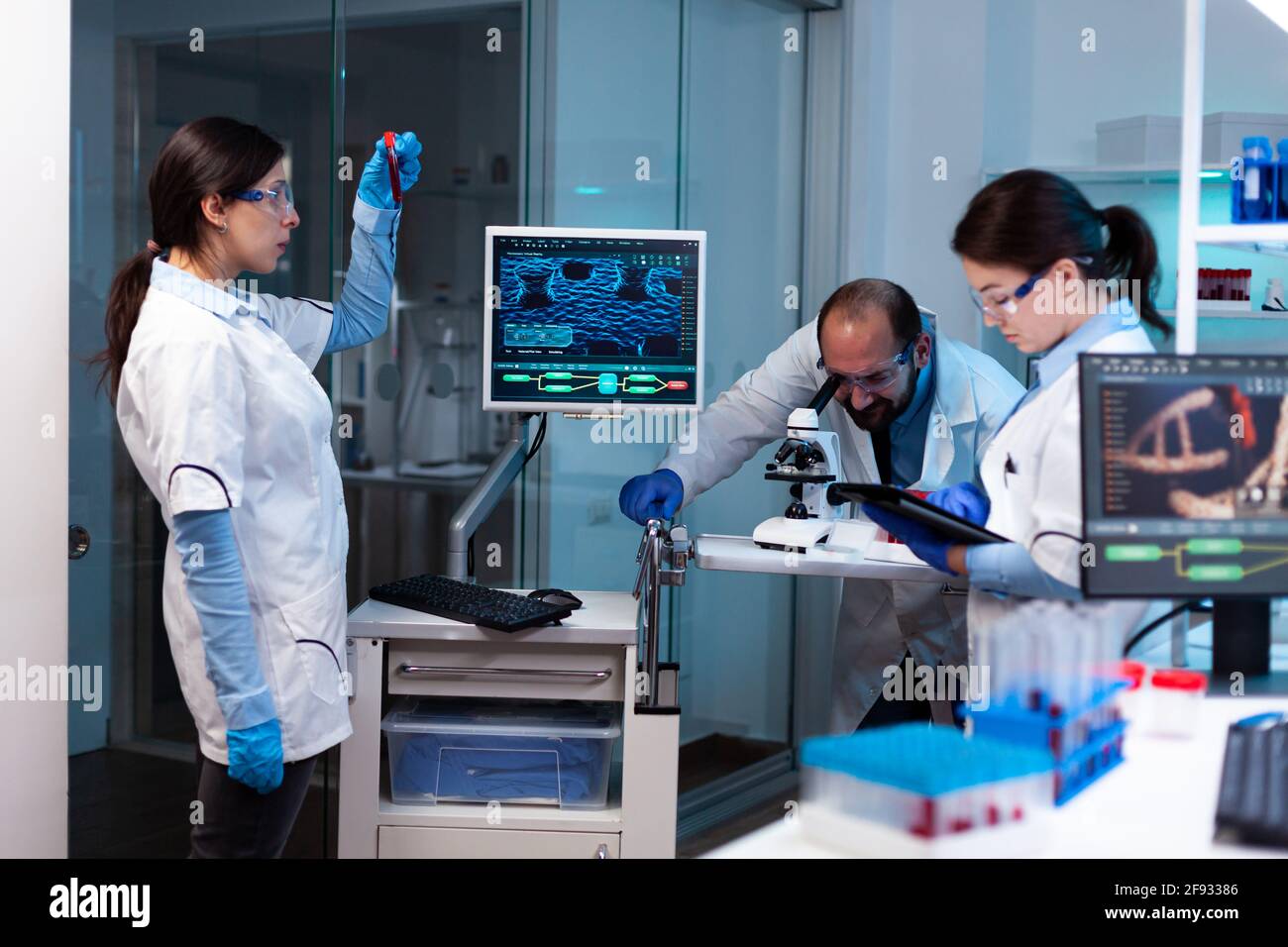 Team of medical research scientists conducting vaccine development ...