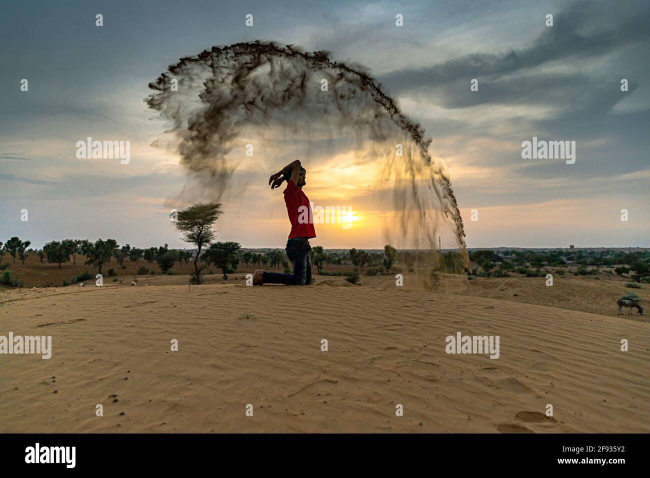 Unidentified man throwing sand hi-res stock photography and images - Alamy