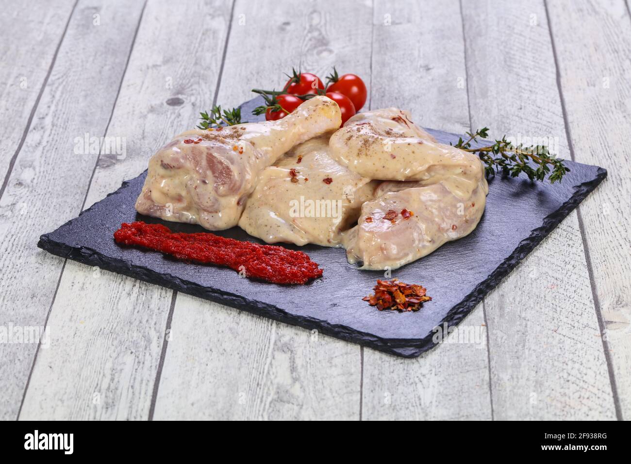 Marinated chicken parts ready for roast Stock Photo - Alamy