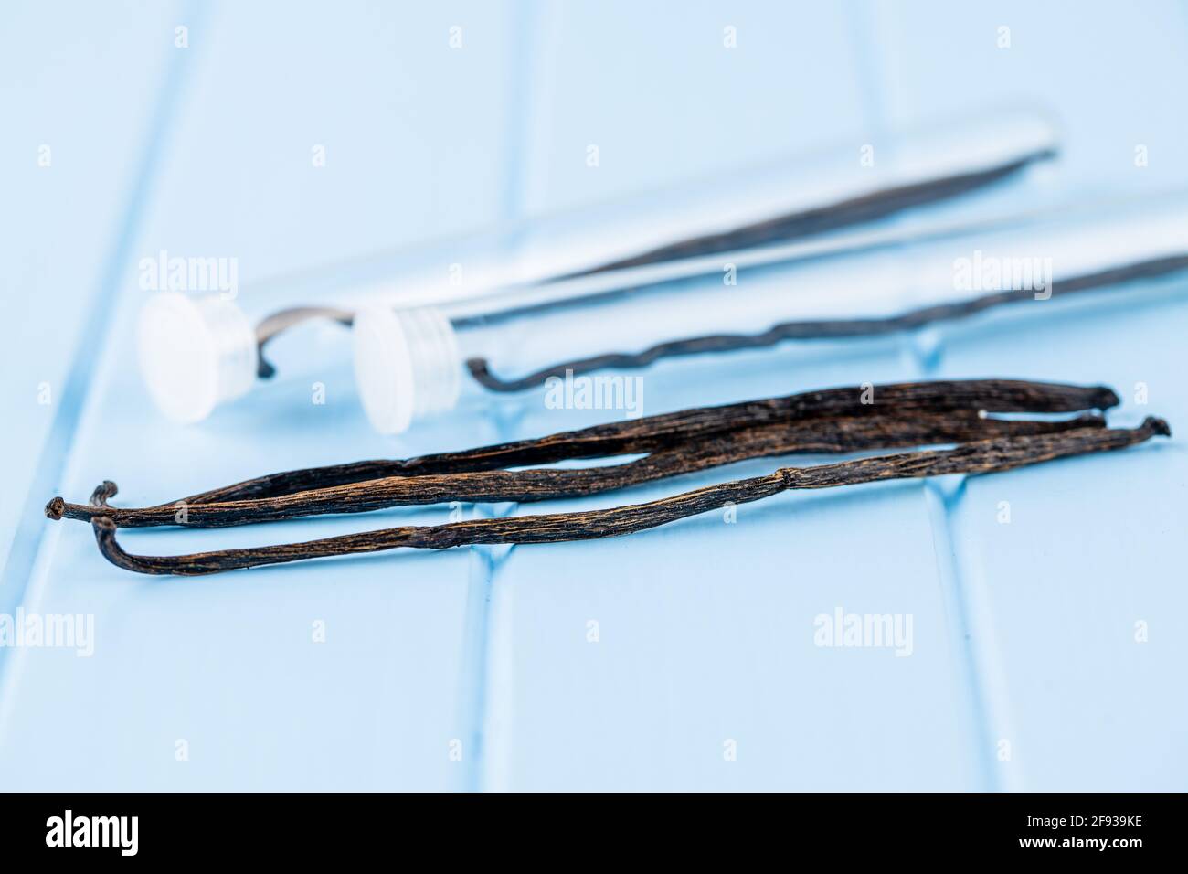 Vanilla pods. Sticks of vanilla on blue table Stock Photo - Alamy