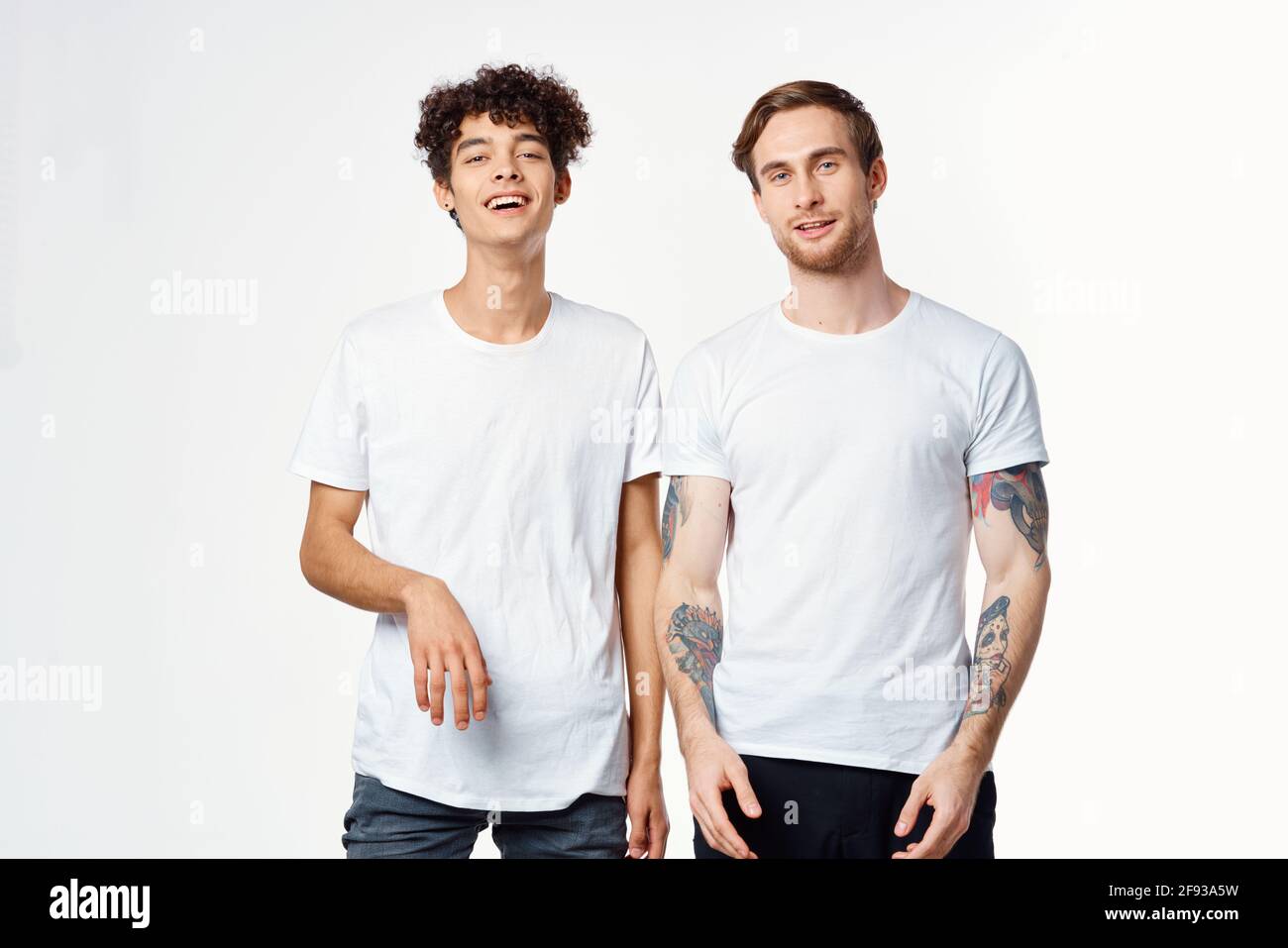Portrait two brothers standing back hi-res stock photography and images ...