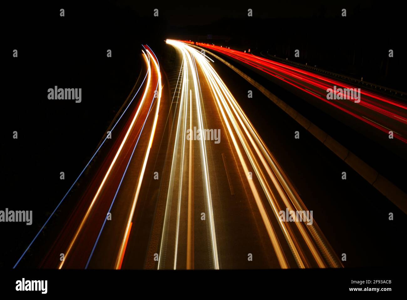 highway at night with driveway and blue light Stock Photo - Alamy