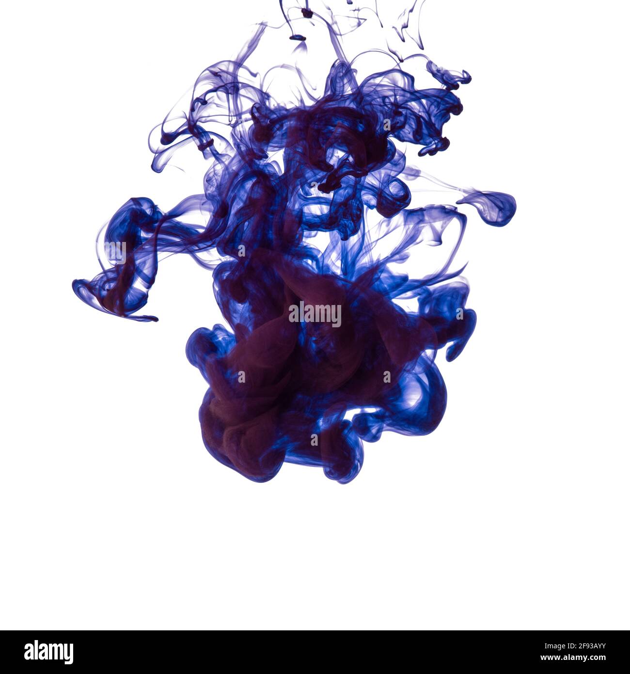 Explosion of colored, fluid and neoned liquids on white studio ...