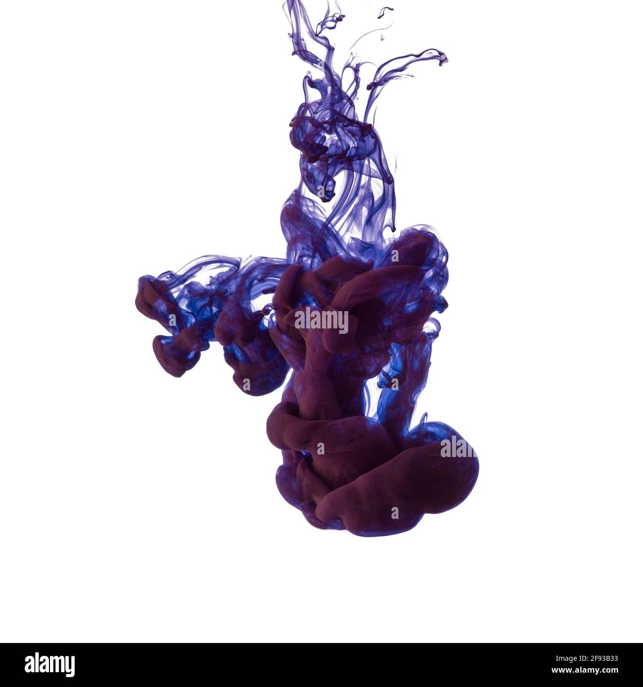 Explosion of colored, fluid and neoned liquids on white studio ...