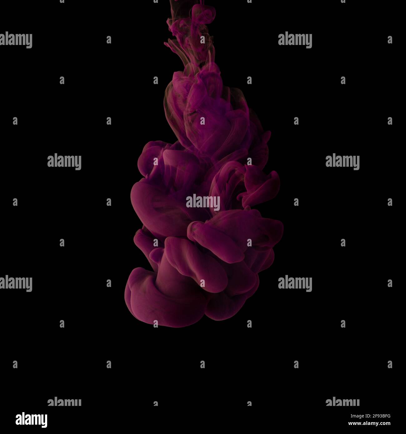 Explosion of colored, fluid and neoned liquids on black studio ...