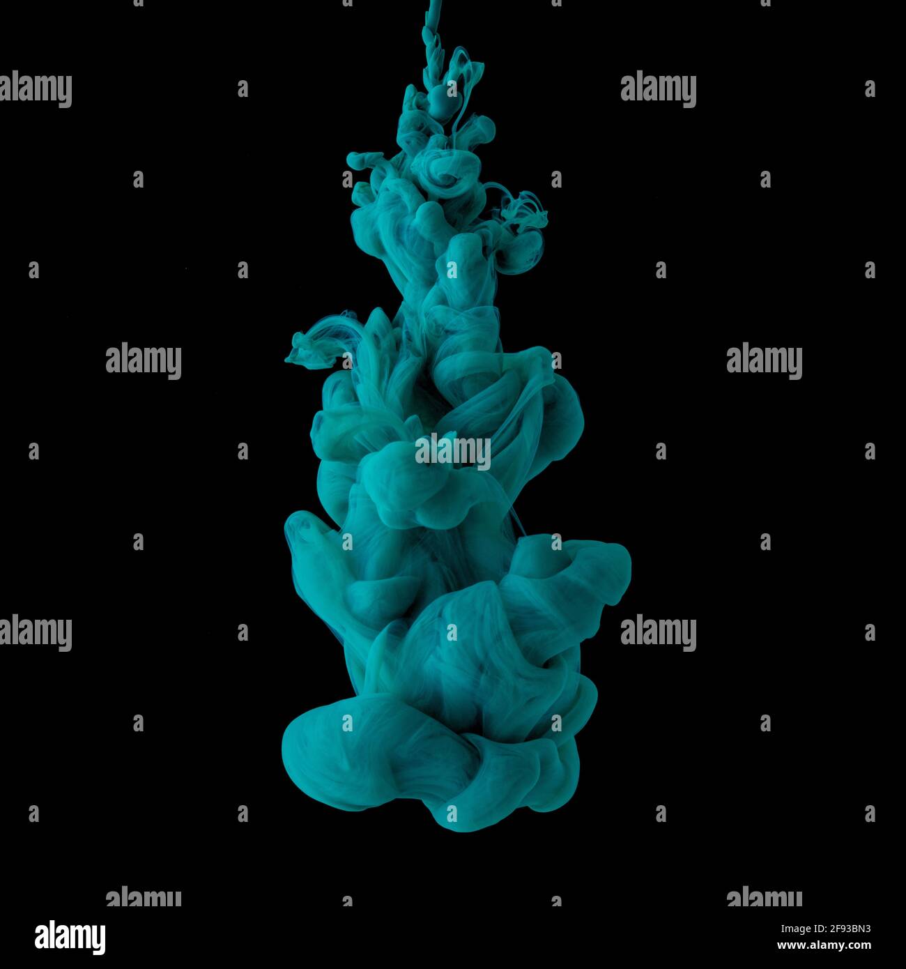 Explosion of colored, fluid and neoned liquids on black studio ...