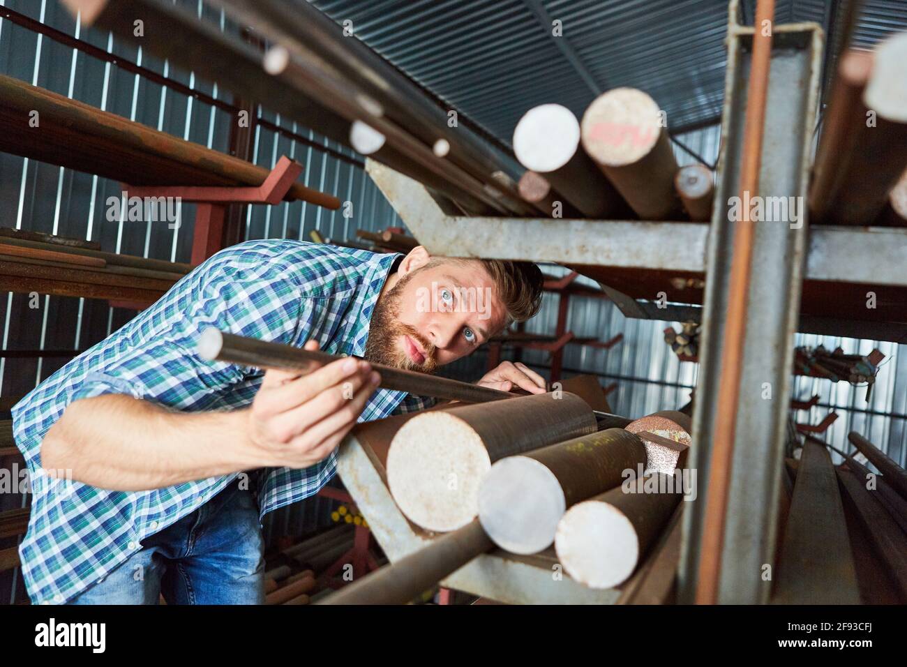 Worker as warehouse clerk during inventory control in the material ...