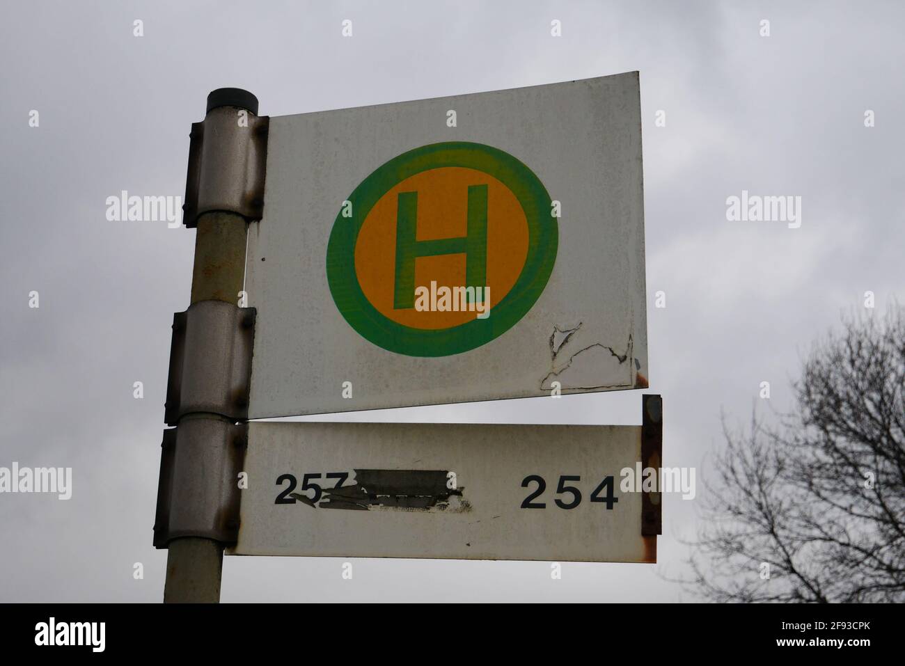 old crooked bus stop sign with numbers Stock Photo - Alamy