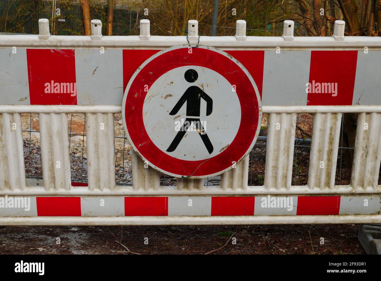 red and white barrier with sign for pedestrians Stock Photo - Alamy