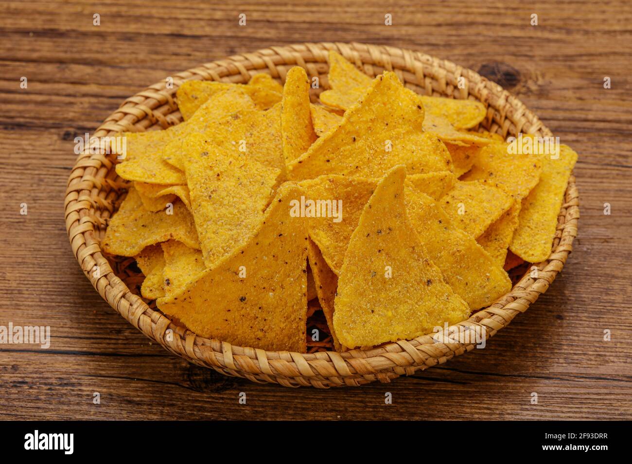 Mexican crunchy corn nachos triangle heap Stock Photo - Alamy