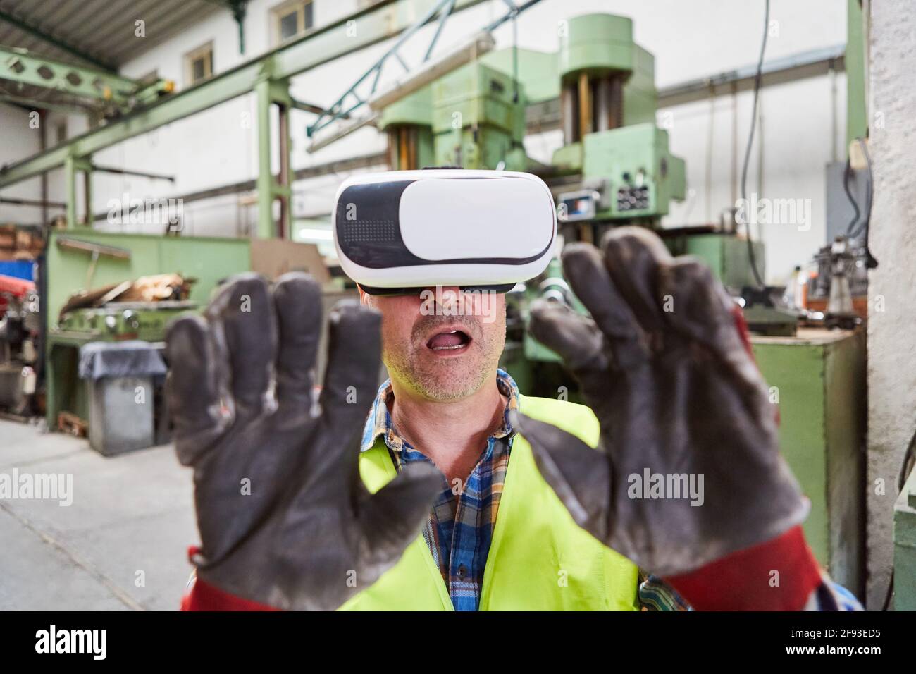 Worker with VR glasses as a virtual reality concept for the industry ...