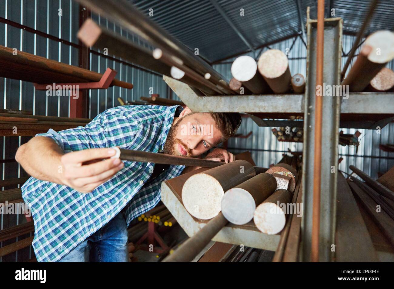 Warehouse clerk controls quality in the material warehouse of the ...