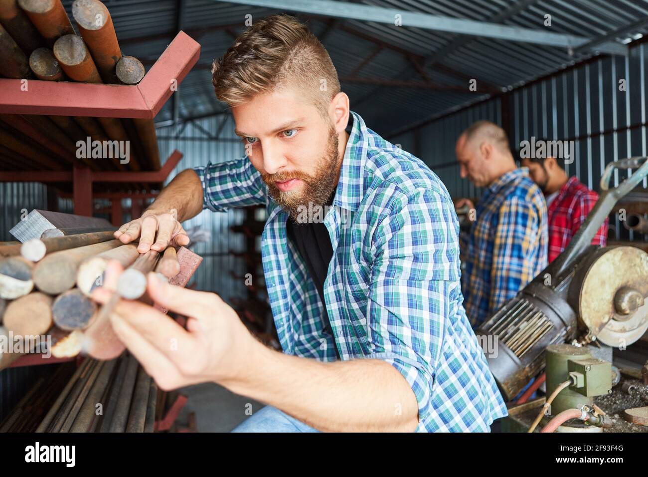 Craftsman during a quality control in the material warehouse of the ...