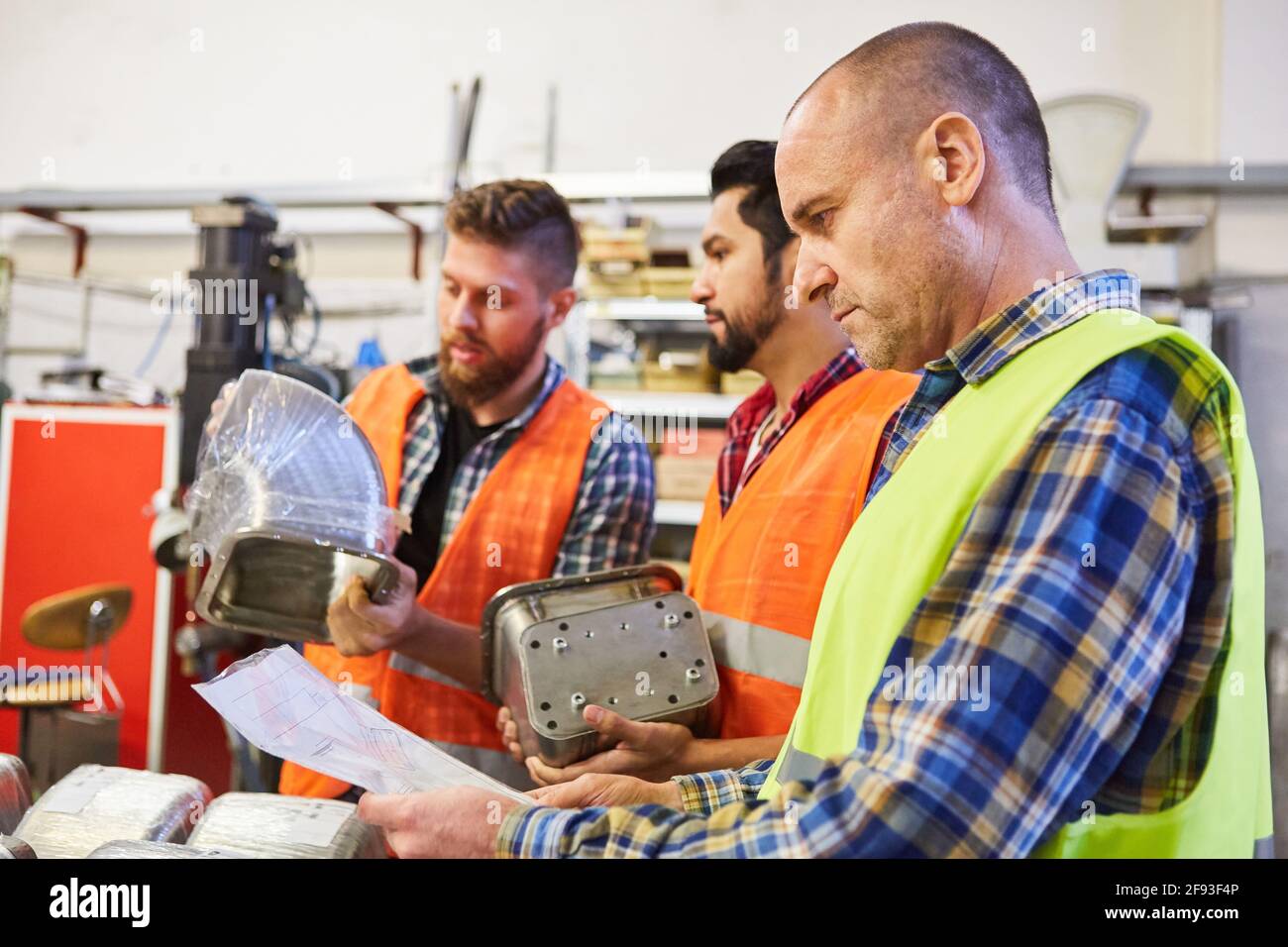 Order picker in the warehouse checks with checklist incoming goods or ...