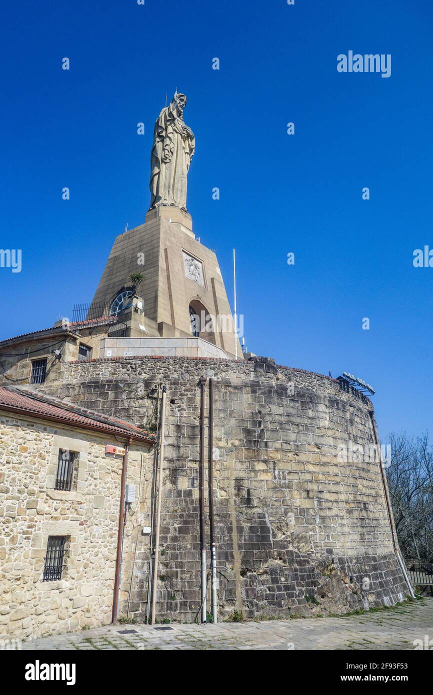 San Sebastian, Spain - April 2, 2021: The Sacred Heart statue and Castillo de la Mota, on Monte ...