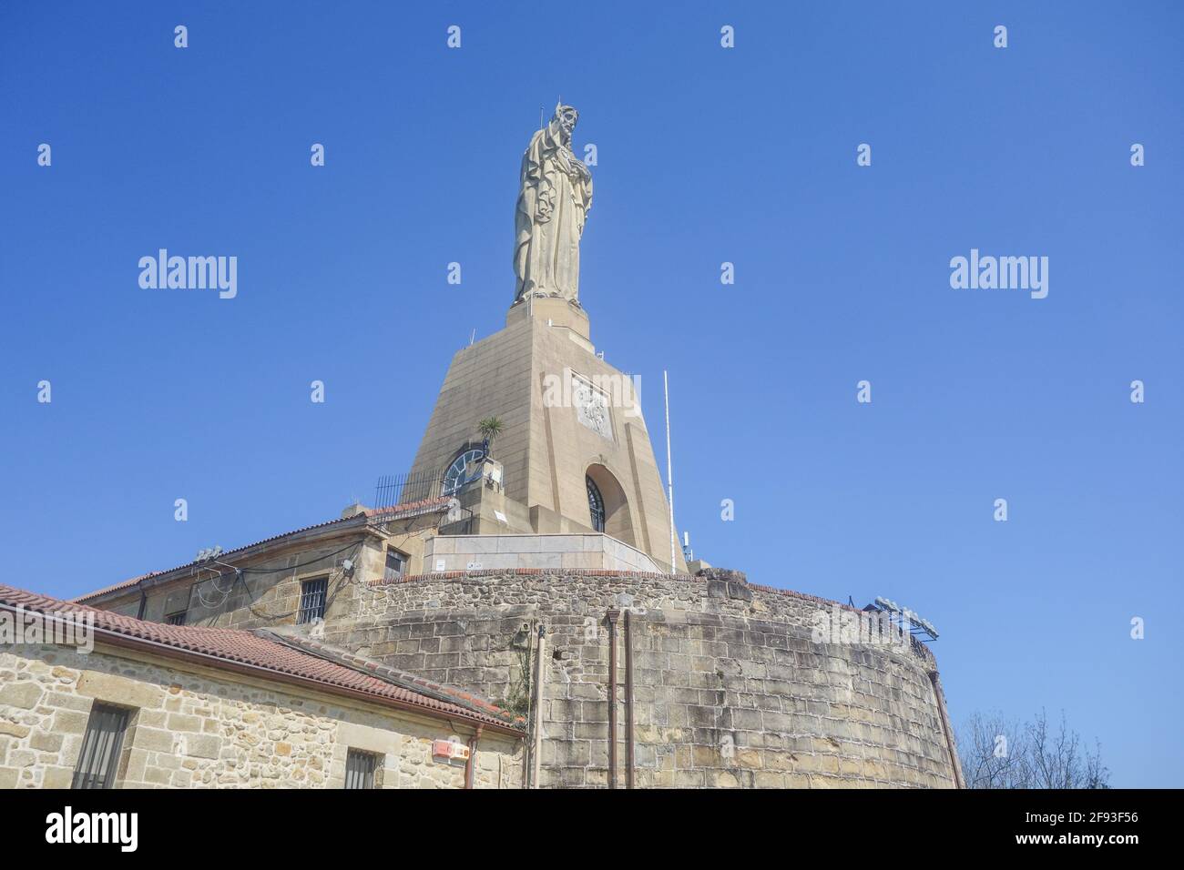 San Sebastian, Spain - April 2, 2021: The Sacred Heart statue and Castillo de la Mota, on Monte ...