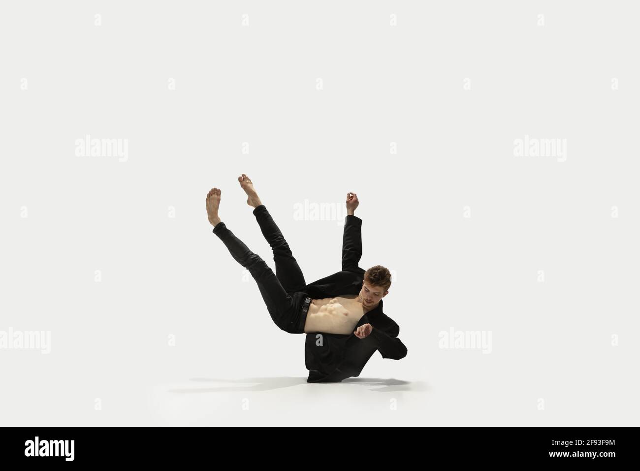 Man in casual style clothes jumping and dancing isolated on white ...