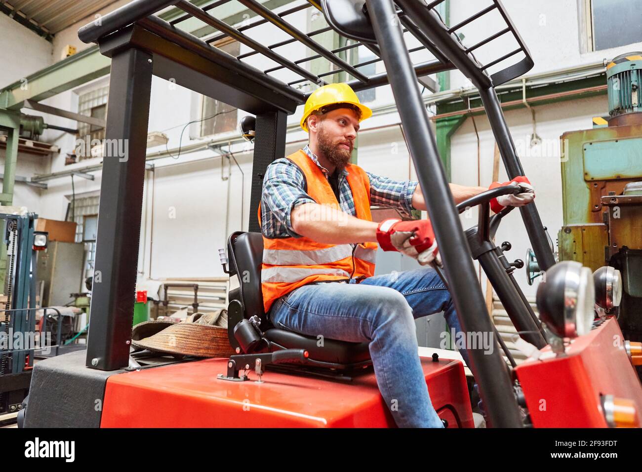 Workers as forklift drivers on the forklift in the factory or in the ...