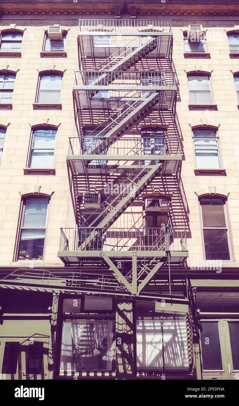 Color toned picture of building with fire escape, New York City, USA ...