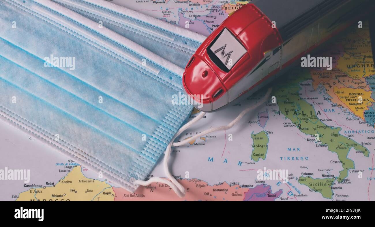 Close up of surgical masks and a train model, concept of new normal ...