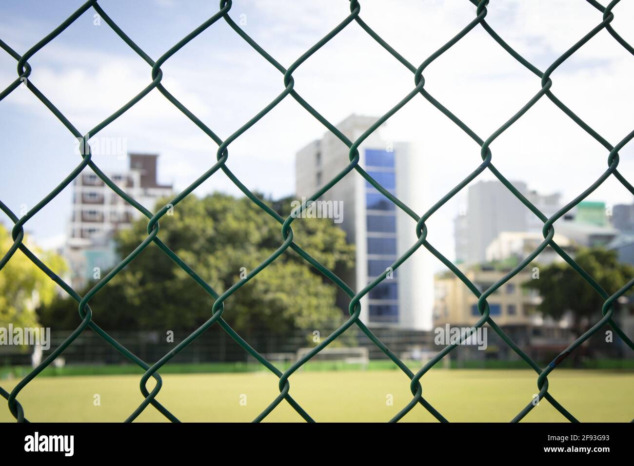 Chain Link Fencing background with blurred buildings back Stock Photo ...