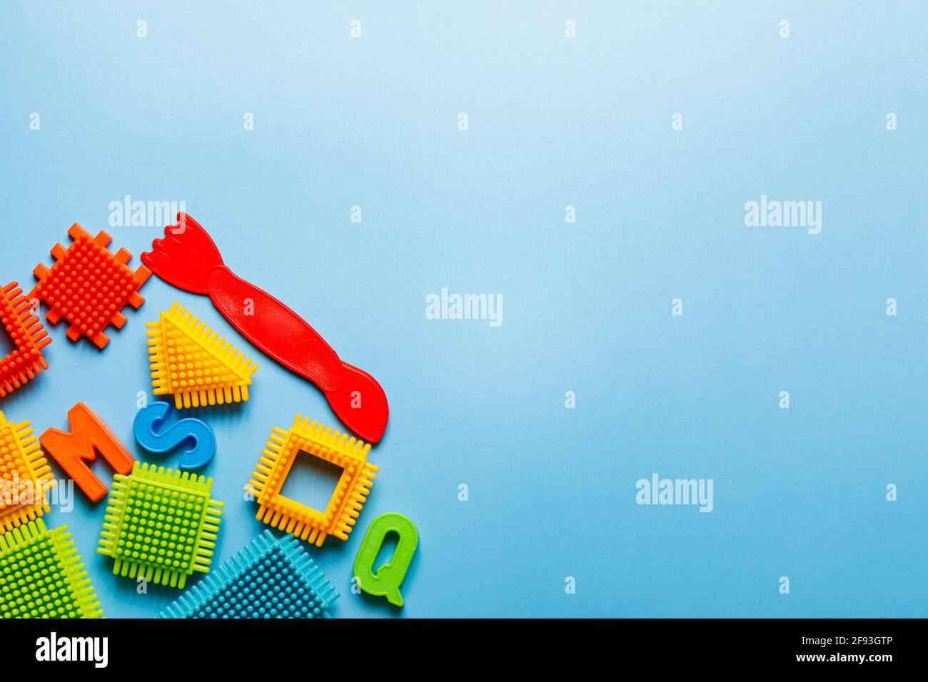 Colorful kids blocks on blue background. Top view Stock Photo - Alamy