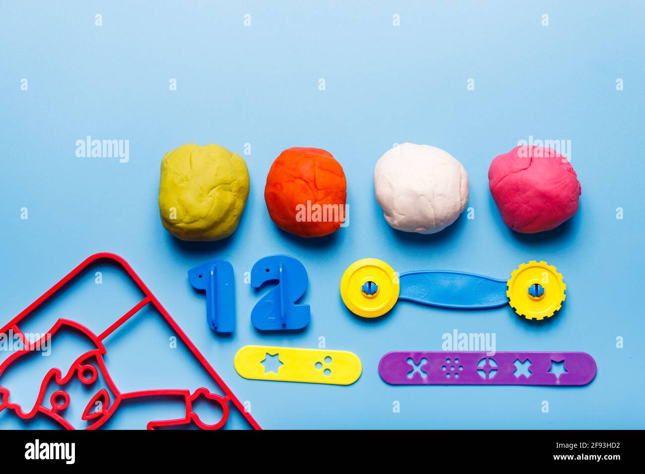 Homemade plasticine, plasticine, play dough on a colored background ...