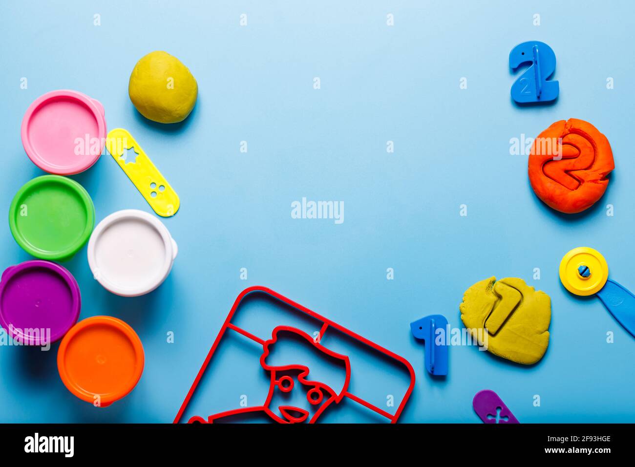 Homemade plasticine, plasticine, play dough on a colored background ...
