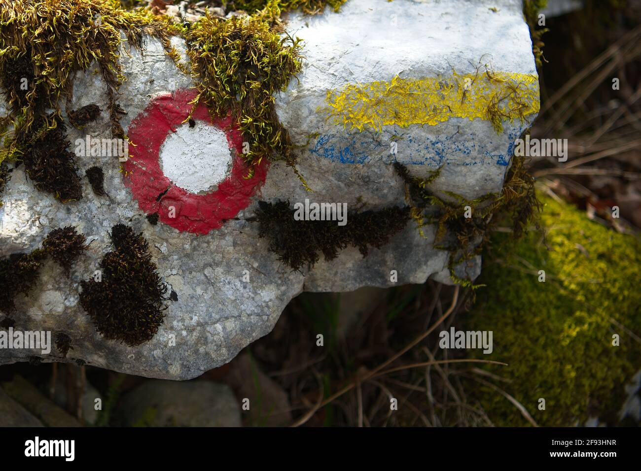 Mountaineering mark drawn on a stone Stock Photo - Alamy