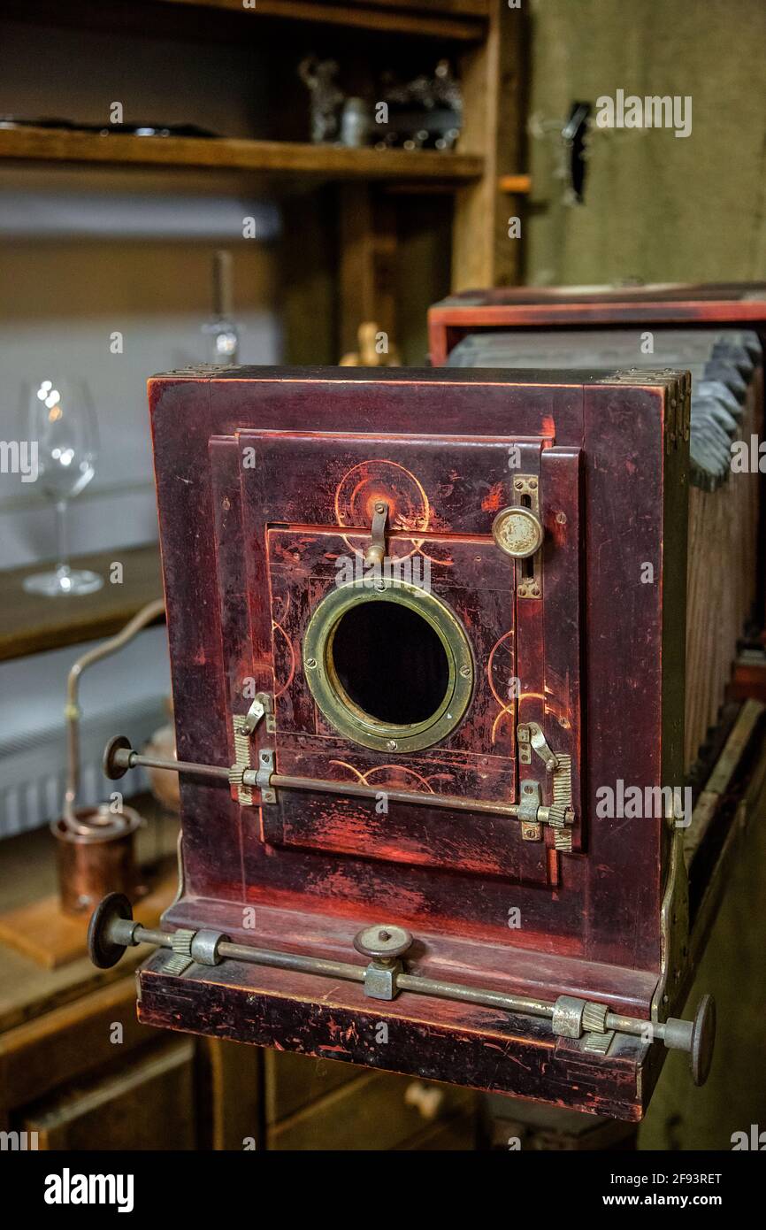 Wooden classic retro camera on tripod on white background Stock Photo ...