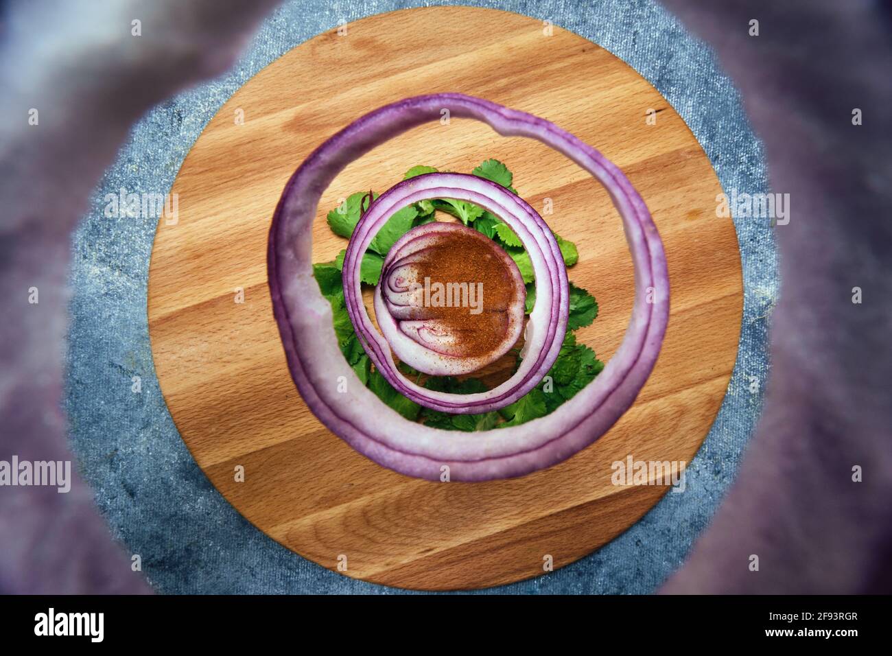 Falling rings of red onion, parsley and pepper Stock Photo - Alamy