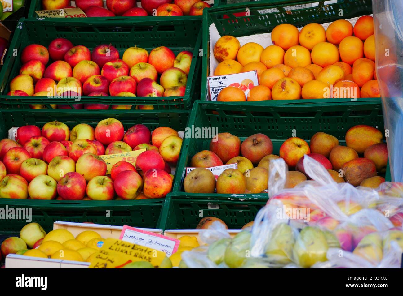 apple pear orange lemon fruit boxes of a shop in the city supermarket ...