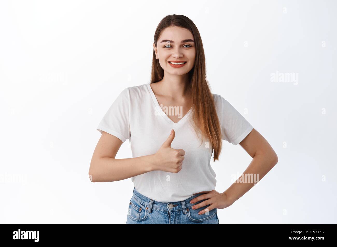 Good job, well done. Smiling supportive girl shows thumbs up with ...