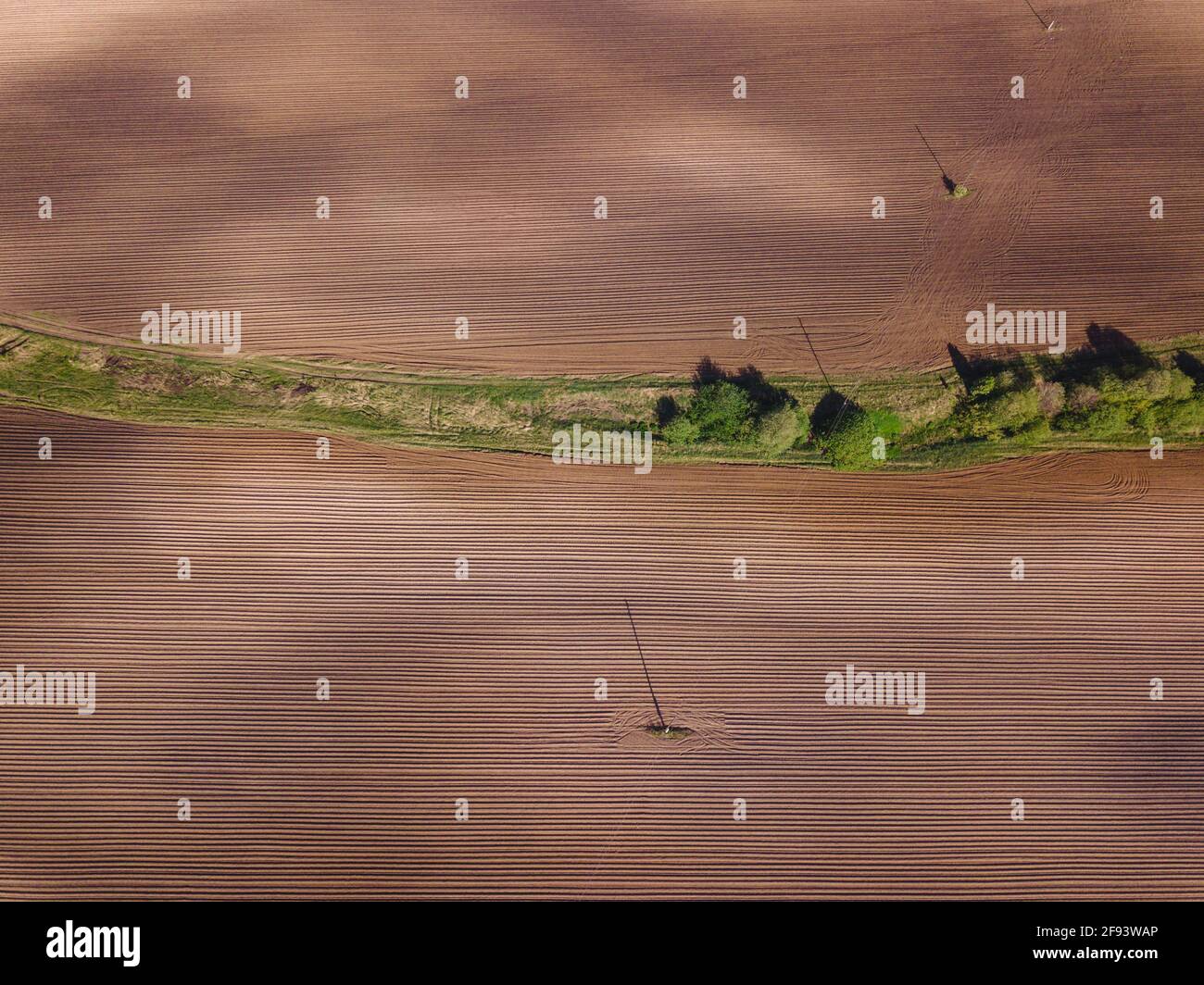 Drone view on a plowed field. Top view Stock Photo - Alamy