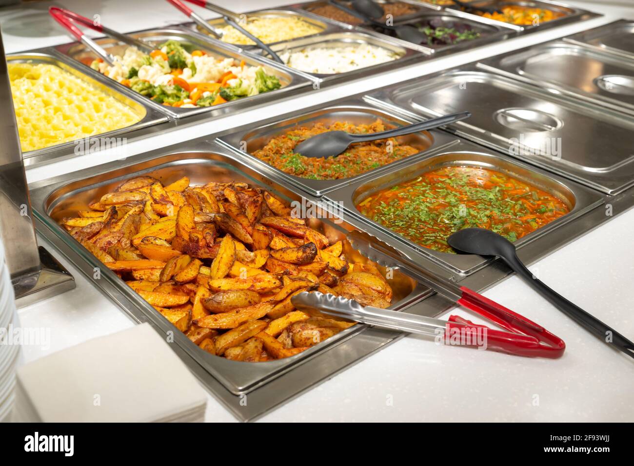 Side dishes on the serving line, self-service restaurant. steamed ...