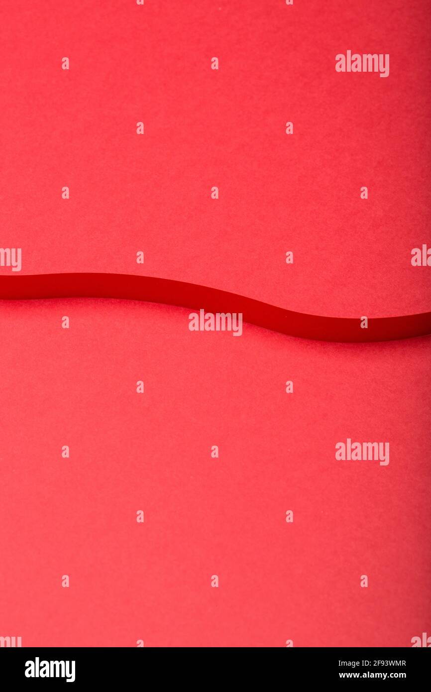 Abstract minimal paper background. Red cut out curvy paper stripe on ...