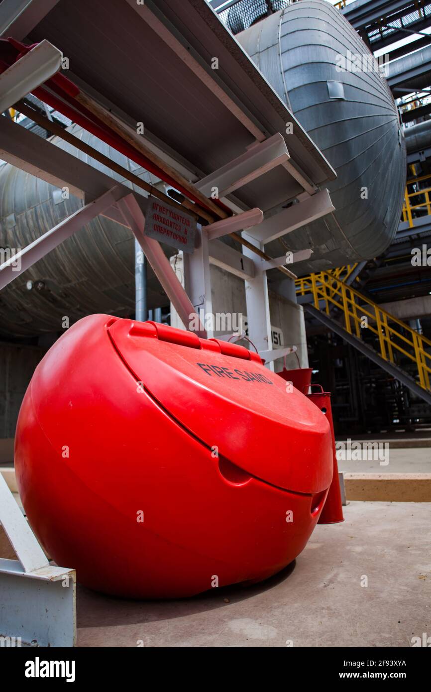 Fire fighting equipment. Sand in red plastic tank . Oil refinery plant ...