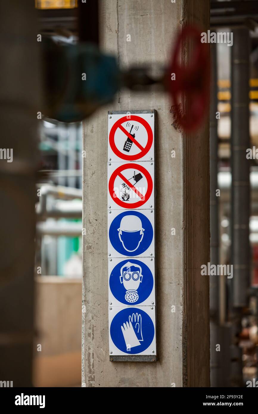 Petrochemical plant. Modern oil refinery plant. Set of warning signs ...