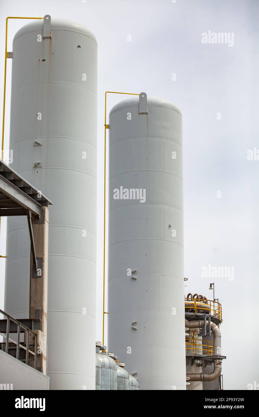 White tanks on grey sky background. Oil refinery plant (refining ...