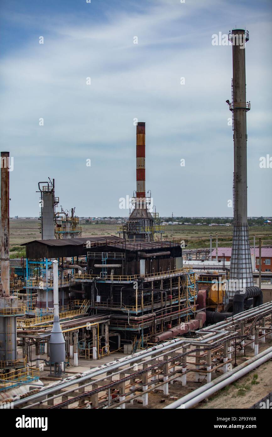 Oil refinery plant in desert. Distillation column, equipment, and ...