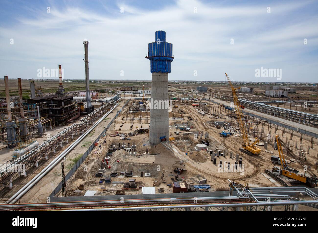 Construction of new concrete smoke stack (plant chimney). Panorama of ...